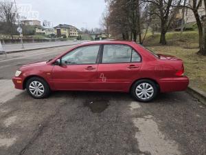 Red Mitsubishi Lancer 2002 in Marijampole, with an engine capacity of 2.00 L and mileage of 194 thousand km for 1800 €, photo 5 on AUTOMOTO.COM.LV