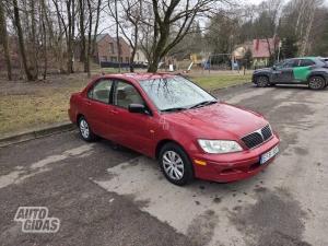 Red Mitsubishi Lancer 2002 in Marijampole, with an engine capacity of 2.00 L and mileage of 194 thousand km for 1800 €, photo 6 on AUTOMOTO.COM.LV