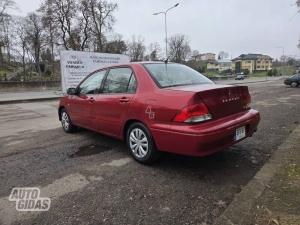 Red Mitsubishi Lancer 2002 in Marijampole, with an engine capacity of 2.00 L and mileage of 194 thousand km for 1800 €, photo 7 on AUTOMOTO.COM.LV