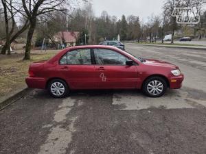 Red Mitsubishi Lancer 2002 in Marijampole, with an engine capacity of 2.00 L and mileage of 194 thousand km for 1800 €, photo 11 on AUTOMOTO.COM.LV