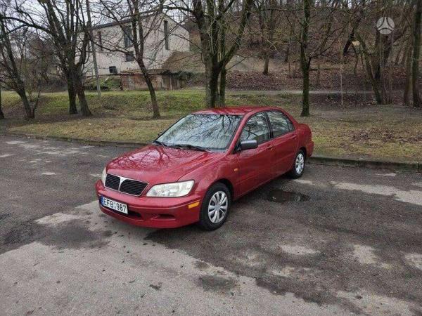 Sarkans Mitsubishi Lancer 2002 Marijampole, ar dzinēja tilpumu 2.00 L un nobraukumu 194 tūkst. km par 1800 €, foto 1 vietnē AUTOMOTO.COM.LV