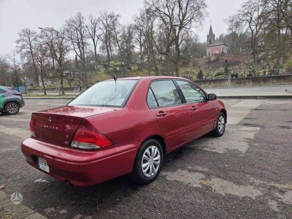 Sarkans Mitsubishi Lancer 2002 Marijampole, ar dzinēja tilpumu 2.00 L un nobraukumu 194 tūkst. km par 1800 €, foto 2 vietnē AUTOMOTO.COM.LV