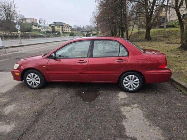Sarkans Mitsubishi Lancer 2002 Marijampole, ar dzinēja tilpumu 2.00 L un nobraukumu 194 tūkst. km par 1800 €, foto 4 vietnē AUTOMOTO.COM.LV