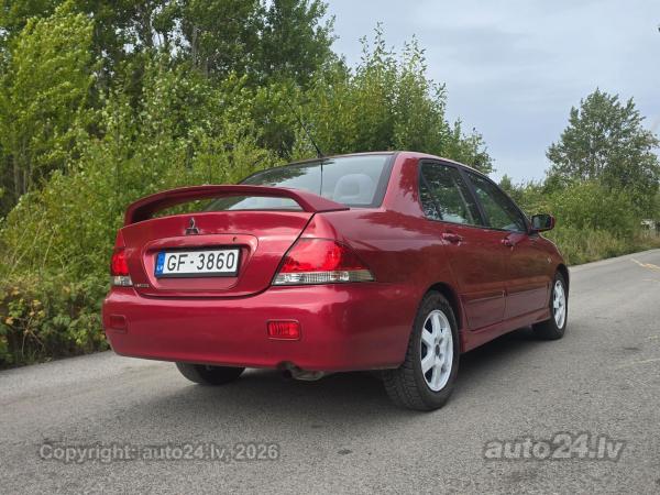 Mitsubishi Lancer 2006 in Tallinn on AUTOMOTO.COM.LV Red Mitsubishi Lancer 2006 in Tallinn, with an engine capacity of 1.60 L and mileage of 108 thousand km for 880 €, photo 3 on AUTOMOTO.COM.LV