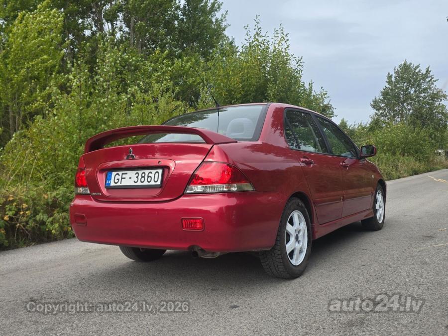 Red Mitsubishi Lancer 2006 in Tallinn, with an engine capacity of 1.60 L and mileage of 108 thousand km for 880 €, photo 3 on AUTOMOTO.COM.LV