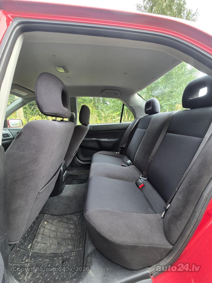 Red Mitsubishi Lancer 2006 in Tallinn, with an engine capacity of 1.60 L and mileage of 108 thousand km for 880 €, photo 14 on AUTOMOTO.COM.LV