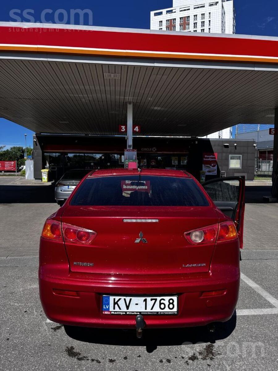 Red Mitsubishi Lancer 2007 in Riga, with an engine capacity of 1.50 L and mileage of 301 thousand km for 2200 €, photo 4 on AUTOMOTO.COM.LV