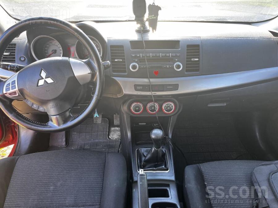 Red Mitsubishi Lancer 2007 in Riga, with an engine capacity of 1.50 L and mileage of 301 thousand km for 2200 €, photo 5 on AUTOMOTO.COM.LV