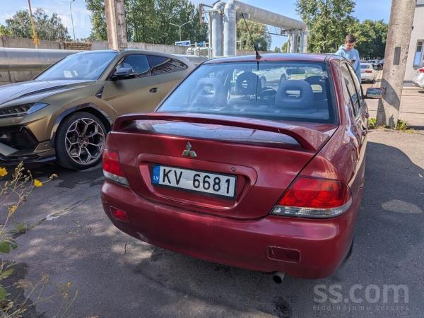 Red Mitsubishi Lancer 2007 in Riga, with an engine capacity of 1.60 L and mileage of 247 thousand km for 800 €, photo 2 on AUTOMOTO.COM.LV