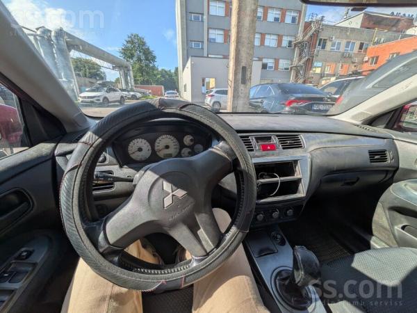 Red Mitsubishi Lancer 2007 in Riga, with an engine capacity of 1.60 L and mileage of 247 thousand km for 800 €, photo 3 on AUTOMOTO.COM.LV