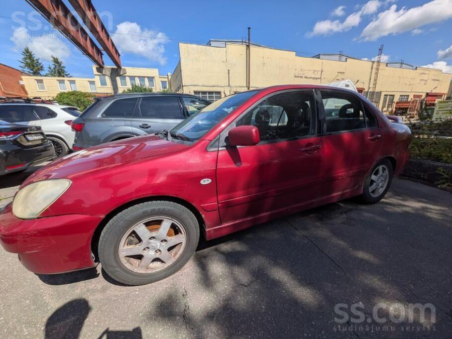 Red Mitsubishi Lancer 2007 in Riga, with an engine capacity of 1.60 L and mileage of 247 thousand km for 800 €, photo 5 on AUTOMOTO.COM.LV