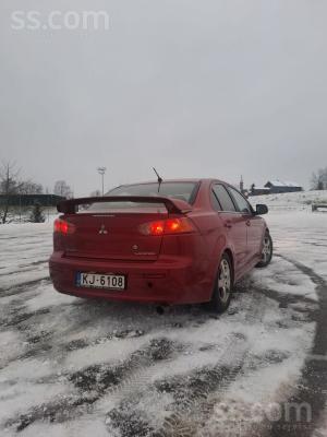 Red Mitsubishi Lancer 2008 in Valmiera, with an engine capacity of 2.00 L and mileage of 0 thousand km for 3900 €, photo 3 on AUTOMOTO.COM.LV