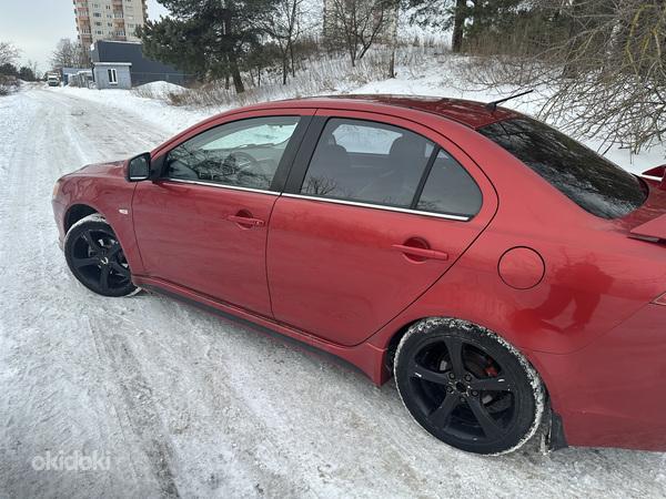 Sarkans Mitsubishi Lancer 2008 Tallina, ar dzinēja tilpumu 1.80 L un nobraukumu 333 tūkst. km par 3400 €, foto 5 vietnē AUTOMOTO.COM.LV