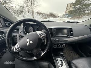 Red Mitsubishi Lancer 2008 in Tallinn, with an engine capacity of 1.80 L and mileage of 333 thousand km for 3400 €, photo 7 on AUTOMOTO.COM.LV