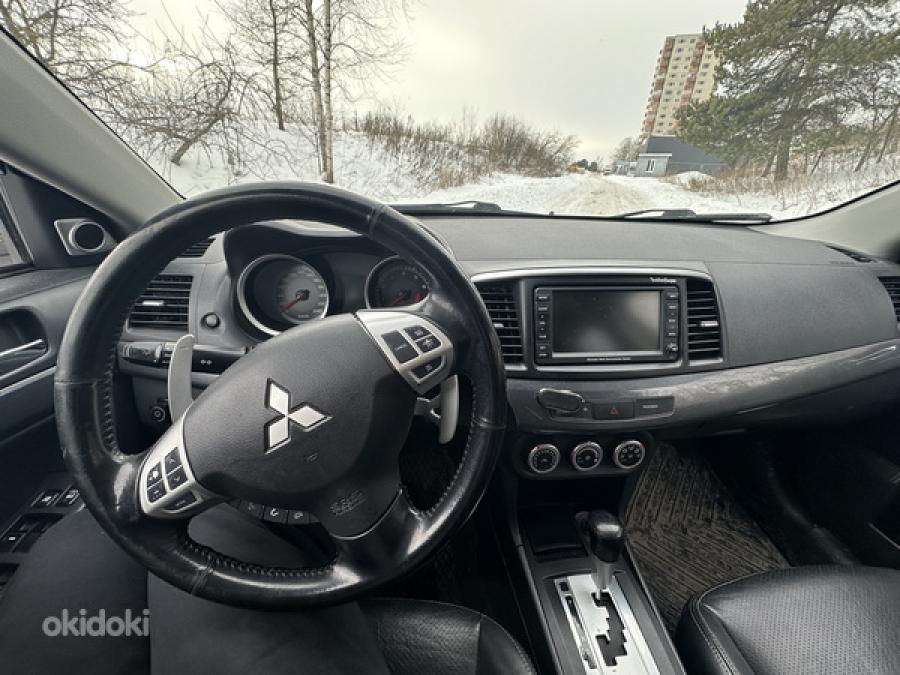 Red Mitsubishi Lancer 2008 in Tallinn, with an engine capacity of 1.80 L and mileage of 333 thousand km for 3400 €, photo 7 on AUTOMOTO.COM.LV