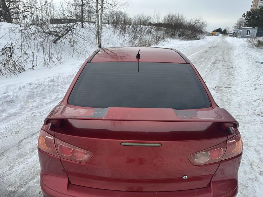 Red Mitsubishi Lancer 2008 in Tallinn, with an engine capacity of 1.80 L and mileage of 333 thousand km for 3400 €, photo 13 on AUTOMOTO.COM.LV