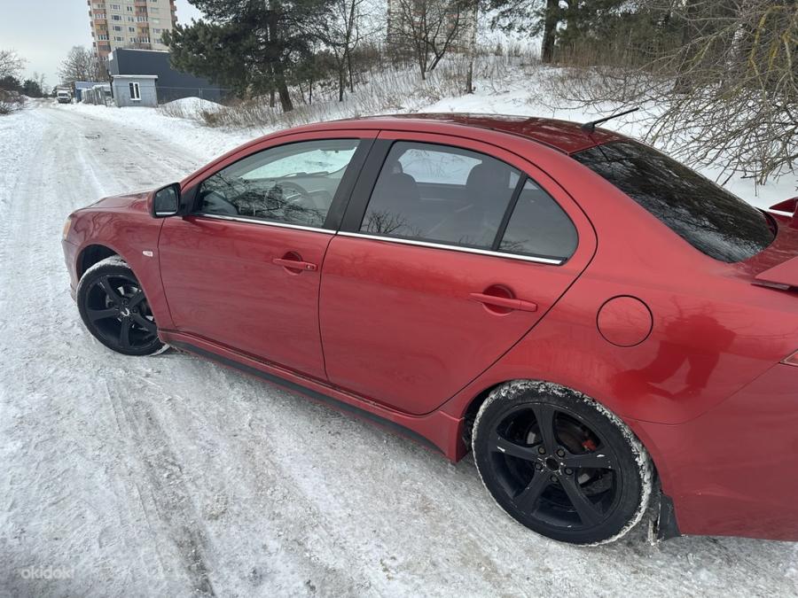 Red Mitsubishi Lancer 2008 in Tallinn, with an engine capacity of 1.80 L and mileage of 333 thousand km for 3400 €, photo 14 on AUTOMOTO.COM.LV