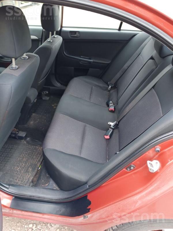 Sarkans Mitsubishi Lancer 2008 Rīga, ar dzinēja tilpumu 1.50 L un nobraukumu 245 tūkst. km par 3000 €, foto 8 vietnē AUTOMOTO.COM.LV