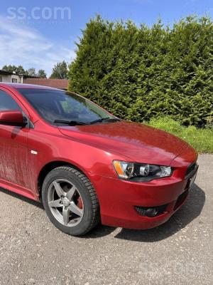 Red Mitsubishi Lancer 2008 in Riga, with an engine capacity of 1.80 L and mileage of 272 thousand km for 2200 €, photo 4 on AUTOMOTO.COM.LV