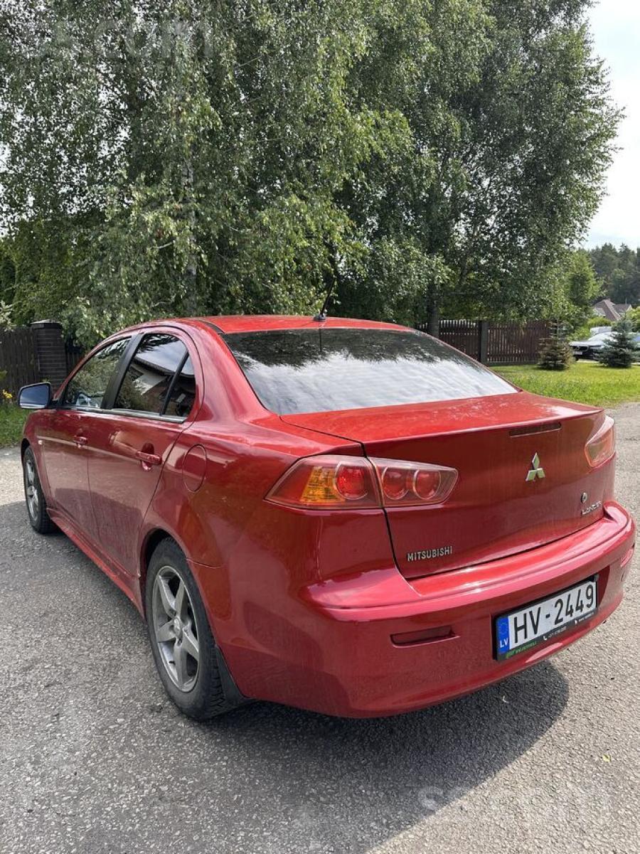 Red Mitsubishi Lancer 2008 in Riga, with an engine capacity of 1.80 L and mileage of 272 thousand km for 2200 €, photo 9 on AUTOMOTO.COM.LV