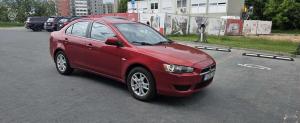 Red Mitsubishi Lancer 2009 in Vilnius, with an engine capacity of 1.80 L and mileage of 230 thousand km for 2150 €, photo 3 on AUTOMOTO.COM.LV