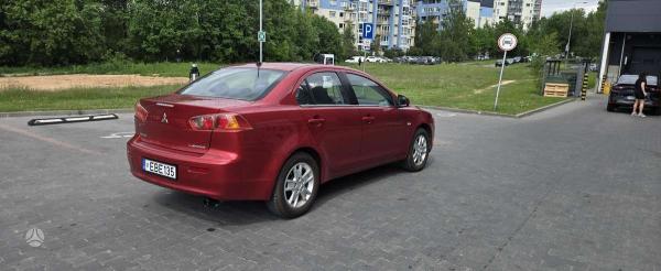 Red Mitsubishi Lancer 2009 in Vilnius, with an engine capacity of 1.80 L and mileage of 230 thousand km for 2150 €, photo 4 on AUTOMOTO.COM.LV