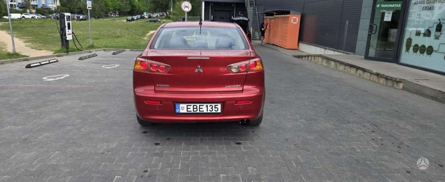 Red Mitsubishi Lancer 2009 in Vilnius, with an engine capacity of 1.80 L and mileage of 230 thousand km for 2150 €, photo 6 on AUTOMOTO.COM.LV