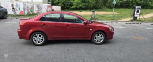 Red Mitsubishi Lancer 2009 in Vilnius, with an engine capacity of 1.80 L and mileage of 230 thousand km for 2150 €, photo 9 on AUTOMOTO.COM.LV
