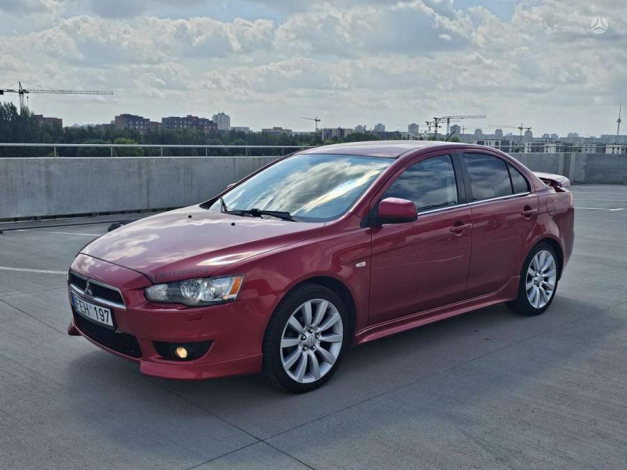 Red Mitsubishi Lancer 2010 in Vilnius, with an engine capacity of 1.80 L and mileage of 201 thousand km for 1850 €, photo 4 on AUTOMOTO.COM.LV