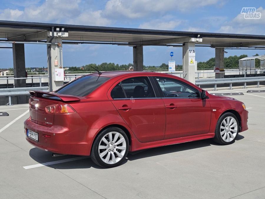 Red Mitsubishi Lancer 2010 in Vilnius, with an engine capacity of 1.80 L and mileage of 201 thousand km for 1850 €, photo 7 on AUTOMOTO.COM.LV