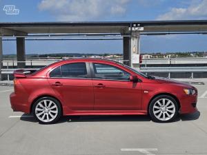 Red Mitsubishi Lancer 2010 in Vilnius, with an engine capacity of 1.80 L and mileage of 201 thousand km for 1850 €, photo 11 on AUTOMOTO.COM.LV