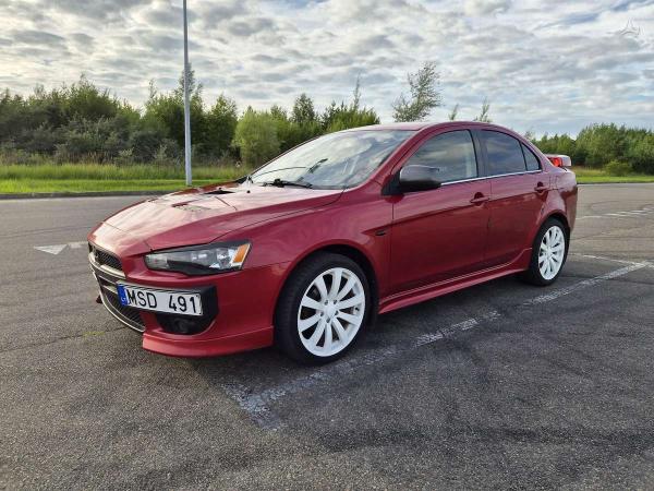 Sarkans Mitsubishi Lancer 2010 Viļņa, ar dzinēja tilpumu 2.00 L un nobraukumu 243 tūkst. km par 3500 €, foto 1 vietnē AUTOMOTO.COM.LV