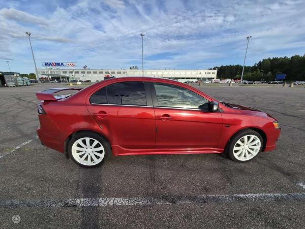 Sarkans Mitsubishi Lancer 2010 Viļņa, ar dzinēja tilpumu 2.00 L un nobraukumu 243 tūkst. km par 3500 €, foto 8 vietnē AUTOMOTO.COM.LV
