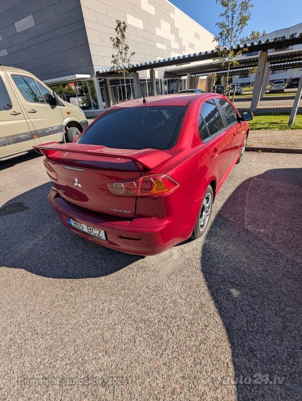 Red Mitsubishi Lancer 2010 in Tallinn, with an engine capacity of 1.80 L and mileage of 210 thousand km for 2499 €, photo 1 on AUTOMOTO.COM.LV