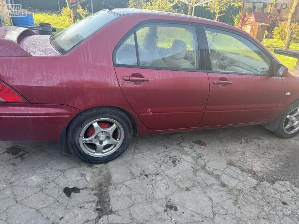 Mitsubishi Lancer 2003 Šauļi, ar dzinēja tilpumu 2.00 L un nobraukumu 250 tūkst. km par 380 €, foto 3 vietnē AUTOMOTO.COM.LV