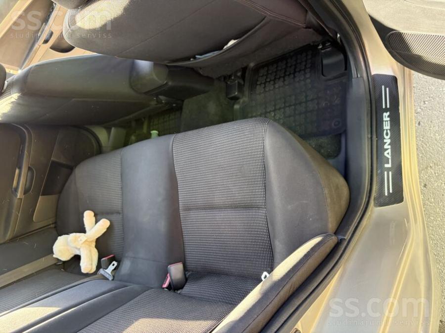 Mitsubishi Lancer 2007 in Riga, with an engine capacity of 1.50 L and mileage of 253 thousand km for 2800 €, photo 15 on AUTOMOTO.COM.LV