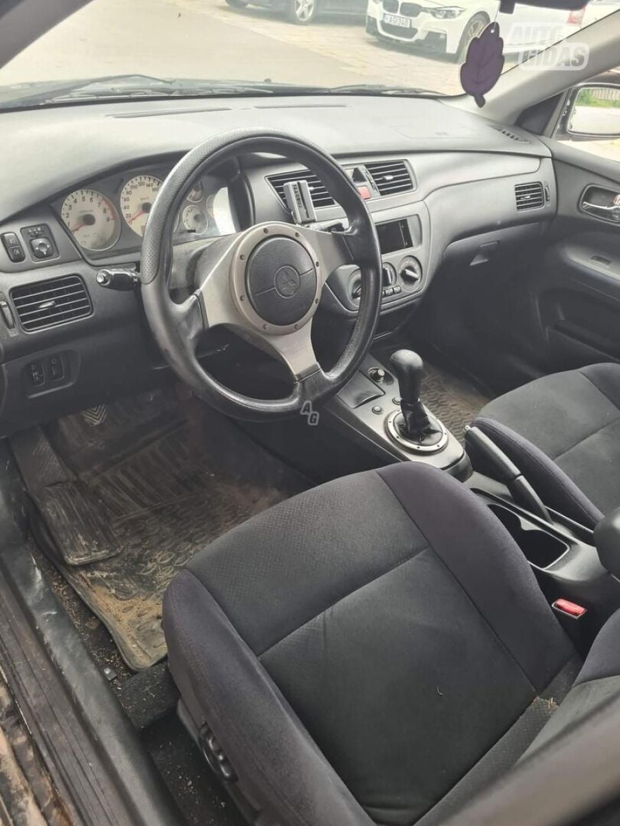 Mitsubishi Lancer 2001 in Klaipeda, with an engine capacity of 1.80 L and mileage of 329 thousand km for 650 €, photo 6 on AUTOMOTO.COM.LV