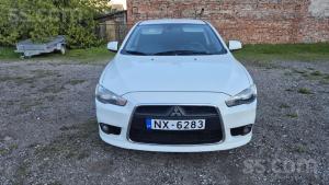 White Mitsubishi Lancer 2009 in Liepaja, with an engine capacity of 1.80 L and mileage of 231 thousand km for 2600 €, photo 2 on AUTOMOTO.COM.LV