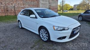 White Mitsubishi Lancer 2009 in Liepaja, with an engine capacity of 1.80 L and mileage of 231 thousand km for 2600 €, photo 3 on AUTOMOTO.COM.LV