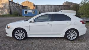 White Mitsubishi Lancer 2009 in Liepaja, with an engine capacity of 1.80 L and mileage of 231 thousand km for 2600 €, photo 7 on AUTOMOTO.COM.LV
