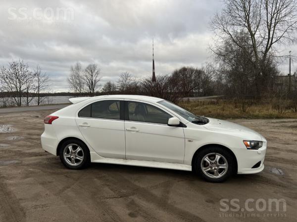 White Mitsubishi Lancer 2012 in Riga, with an engine capacity of 1.80 L and mileage of 217 thousand km for 6000 €, photo 8 on AUTOMOTO.COM.LV