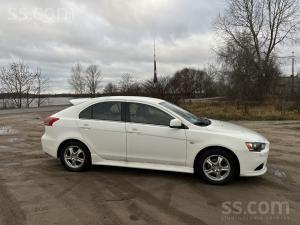White Mitsubishi Lancer 2012 in Riga, with an engine capacity of 1.80 L and mileage of 217 thousand km for 6000 €, photo 8 on AUTOMOTO.COM.LV