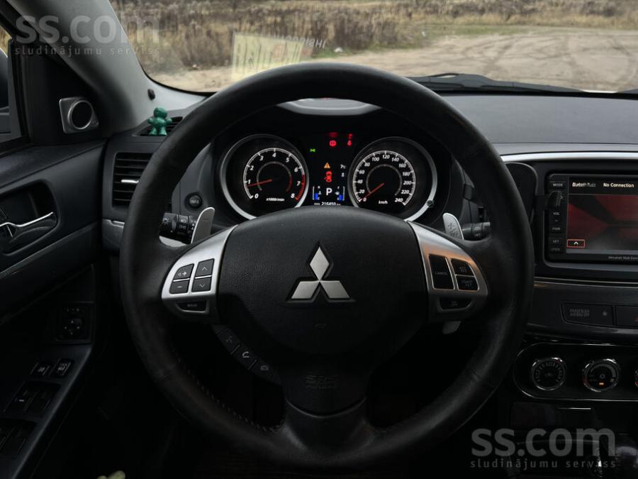 White Mitsubishi Lancer 2012 in Riga, with an engine capacity of 1.80 L and mileage of 217 thousand km for 6000 €, photo 10 on AUTOMOTO.COM.LV