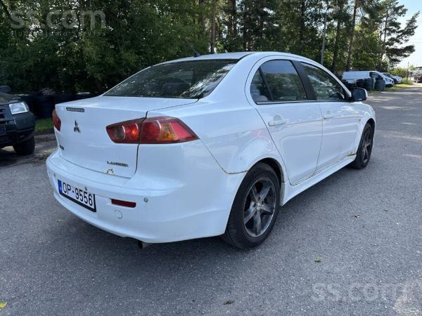 White Mitsubishi Lancer 2008 in Riga, with an engine capacity of 1.80 L and mileage of 0 thousand km for 990 €, photo 4 on AUTOMOTO.COM.LV