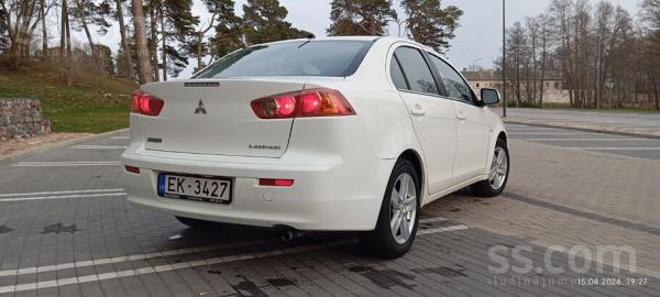 White Mitsubishi Lancer 2009 in Ventspils, with an engine capacity of 1.50 L and mileage of 239 thousand km for 1900 €, photo 6 on AUTOMOTO.COM.LV