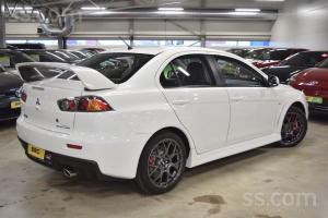 White Mitsubishi Lancer 2014 in Riga, with an engine capacity of 2.00 L and mileage of 117 thousand km for 37400 €, photo 2 on AUTOMOTO.COM.LV