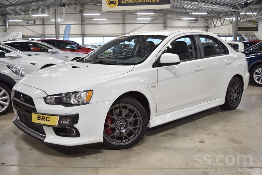 White Mitsubishi Lancer 2014 in Riga, with an engine capacity of 2.00 L and mileage of 117 thousand km for 34900 €, photo 1 on AUTOMOTO.COM.LV