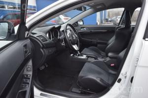 White Mitsubishi Lancer 2014 in Riga, with an engine capacity of 2.00 L and mileage of 117 thousand km for 34900 €, photo 4 on AUTOMOTO.COM.LV