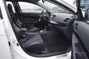 White Mitsubishi Lancer 2014 in Riga, with an engine capacity of 2.00 L and mileage of 117 thousand km for 34900 €, photo 12 on AUTOMOTO.COM.LV