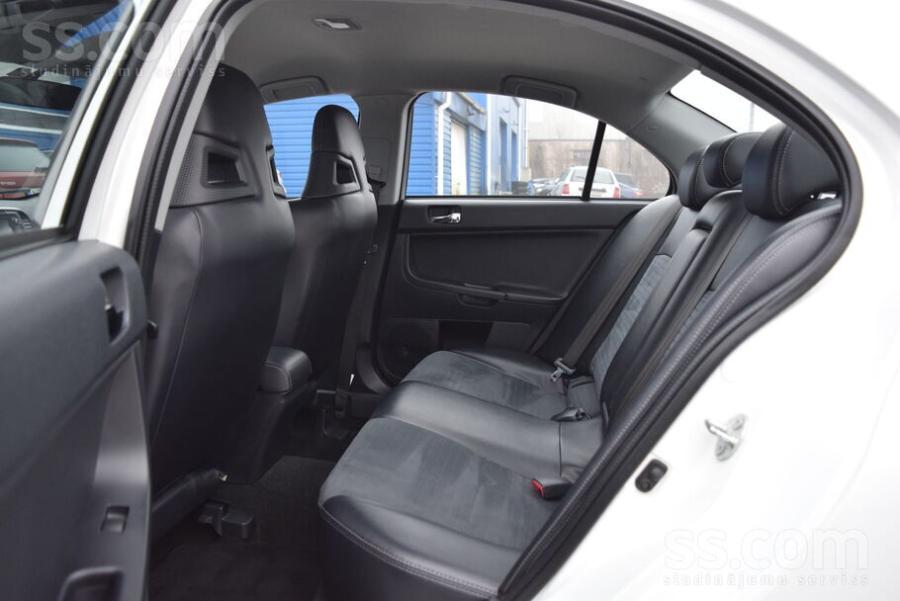 White Mitsubishi Lancer 2014 in Riga, with an engine capacity of 2.00 L and mileage of 117 thousand km for 34900 €, photo 14 on AUTOMOTO.COM.LV